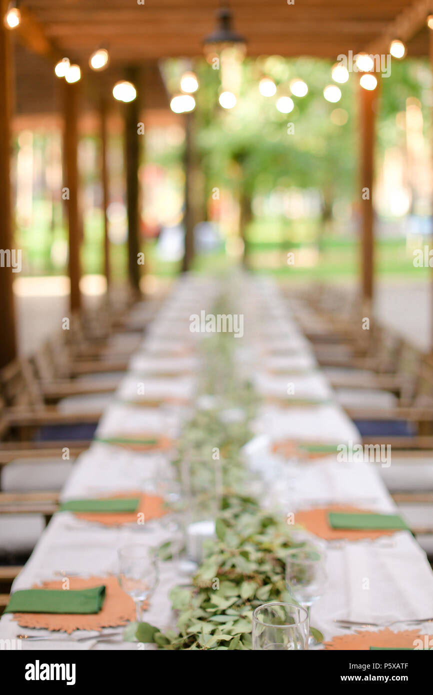 Long table served and decorated for banquet Stock Photo - Alamy