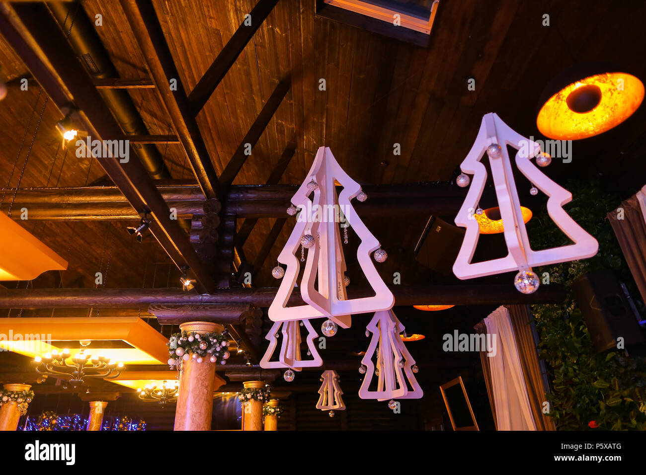White fir tree decorations for Christmas on ceiling Stock Photo - Alamy