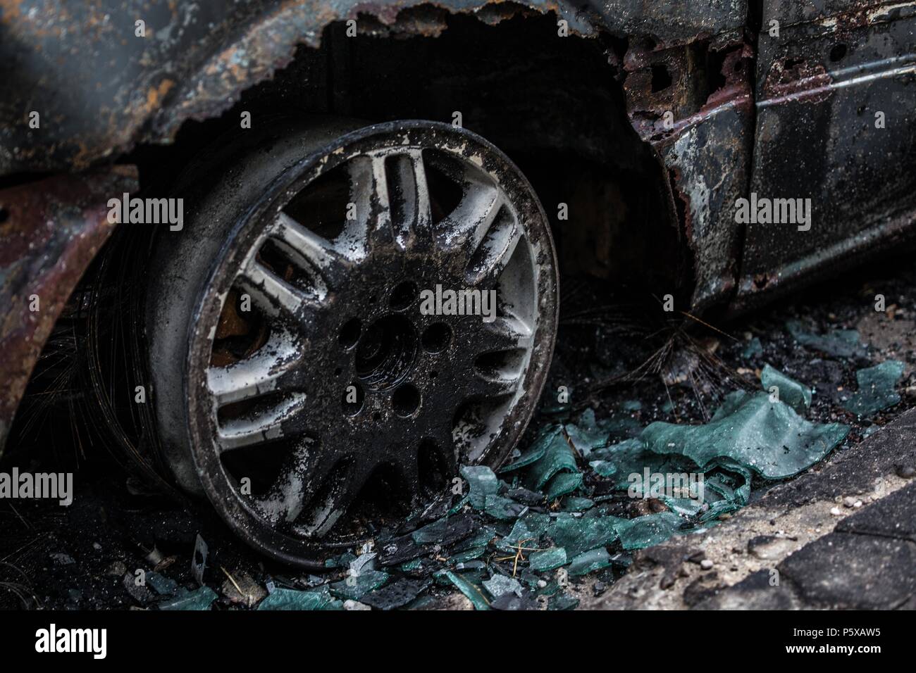 Burnt car on road. Burnt tire and molten glass. Car accident Stock ...