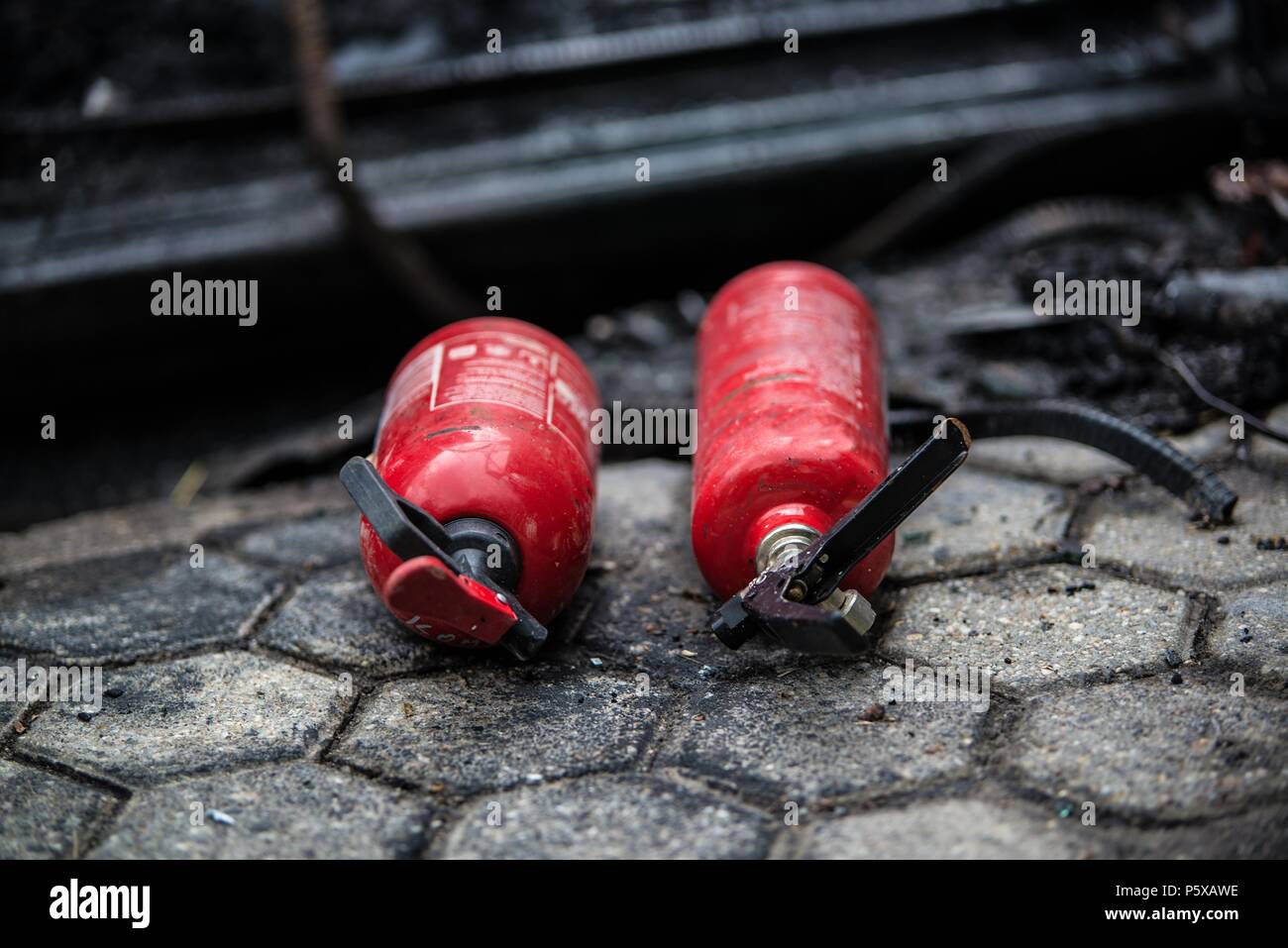 Used car red fire extinguisher. Burnt car on road. Car accident Stock ...