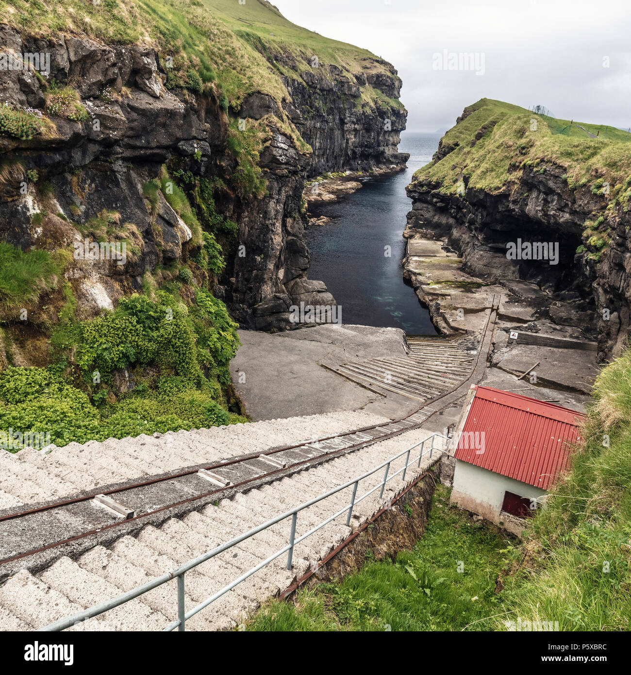 famous natural harbours in Gjogv faroe island Stock Photo - Alamy
