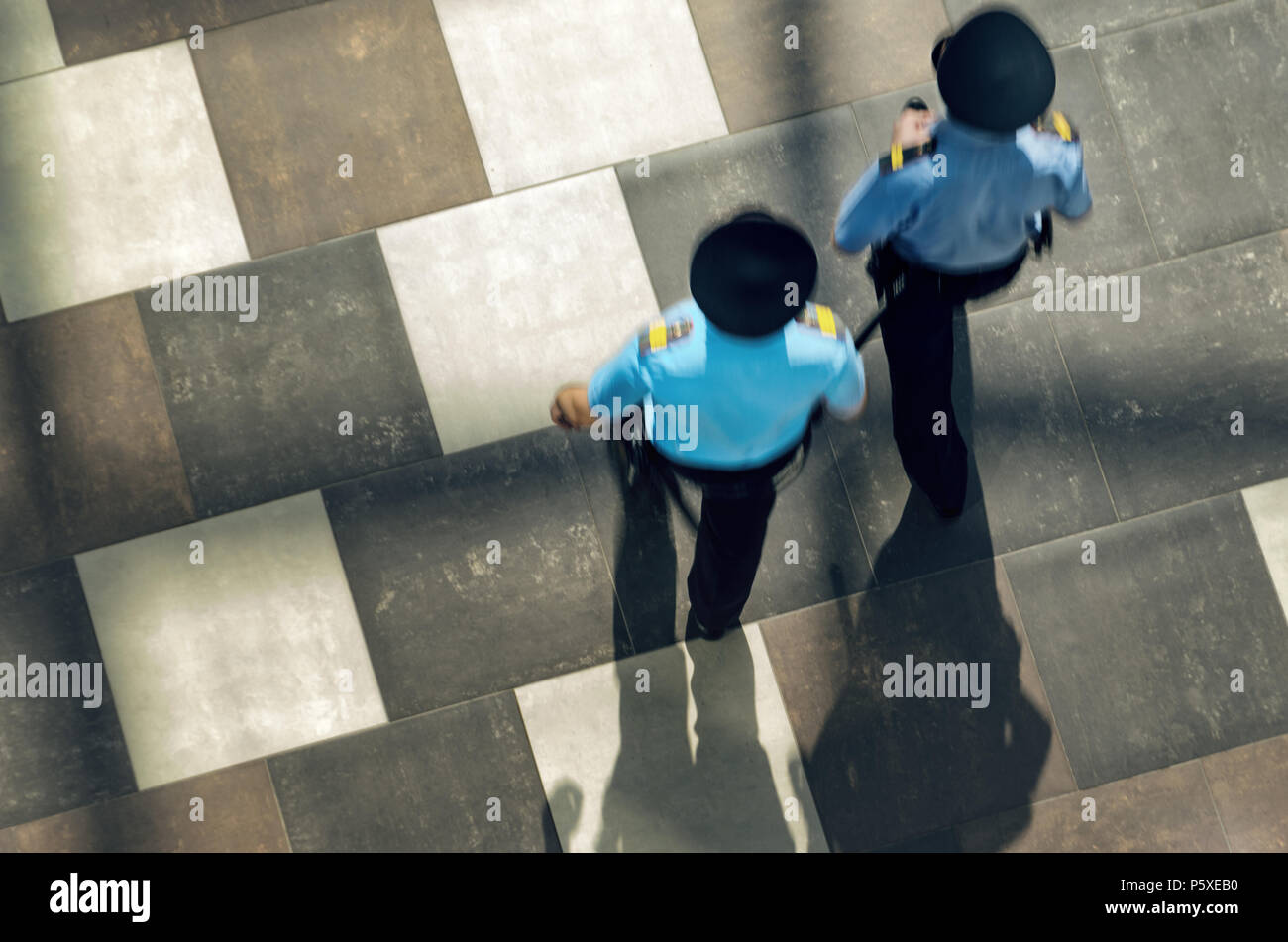 Two Policemen Patrolling the Area, Top View. Abstract Background ...
