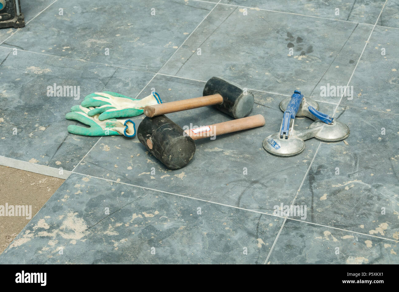 paving tools such as rubber hammers and handles with suction cups Stock ...