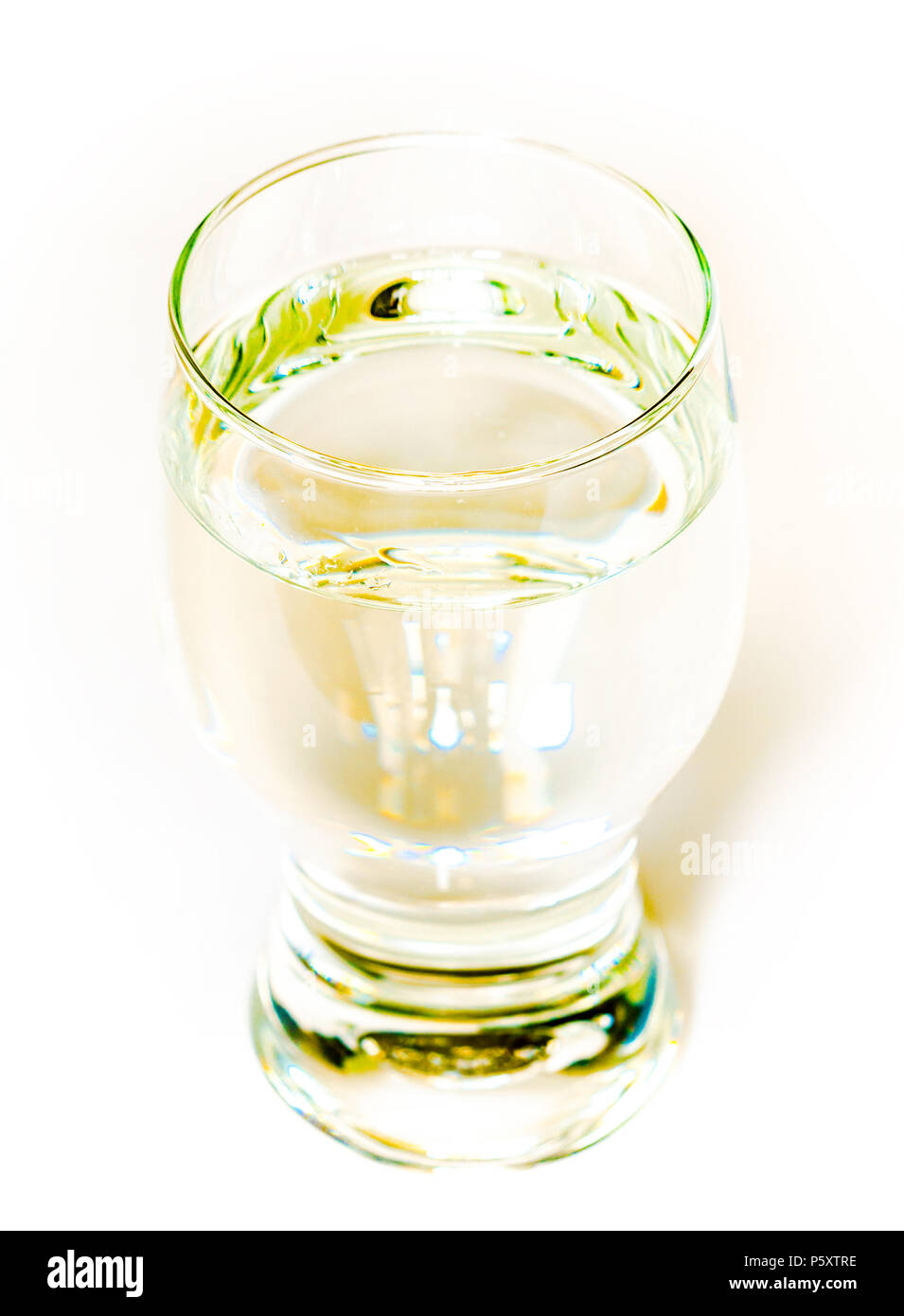 glass of yellow drink Stock Photo - Alamy