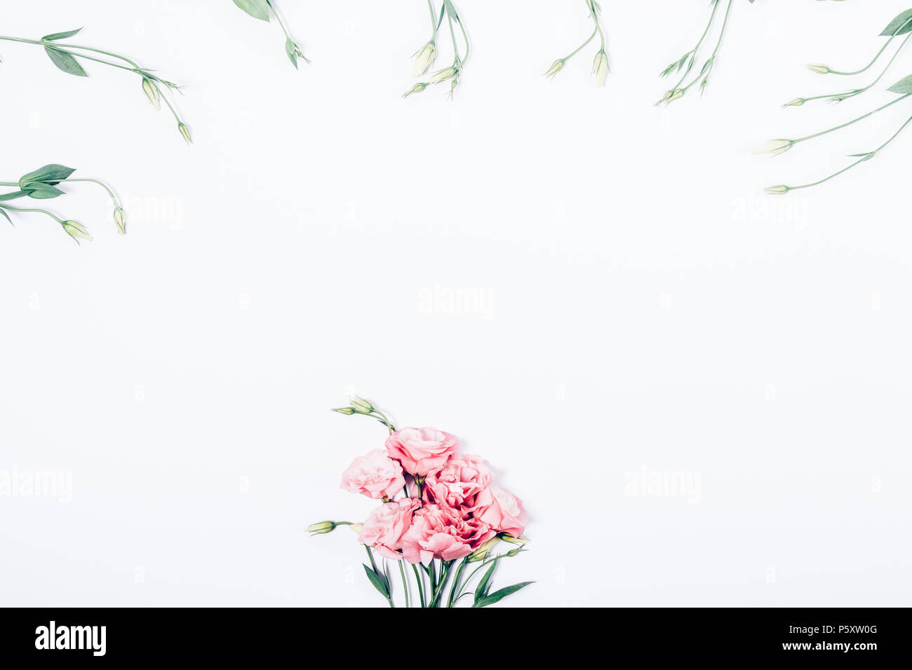 Bouquet of blooming pink flowers placed in the bottom of white ...