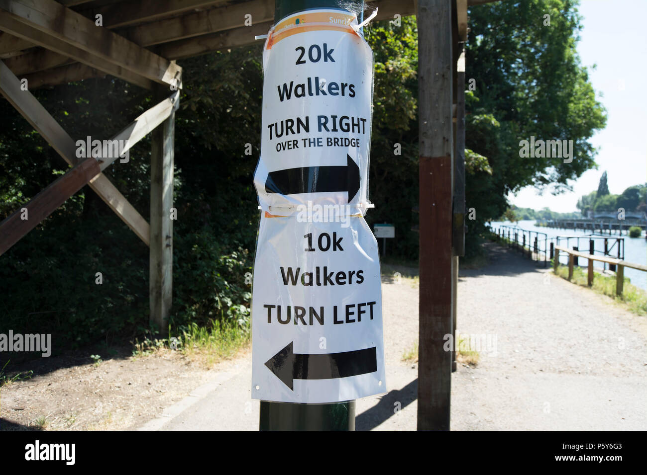 temporary signs at teddington lock bridge giving directions for walkers ...