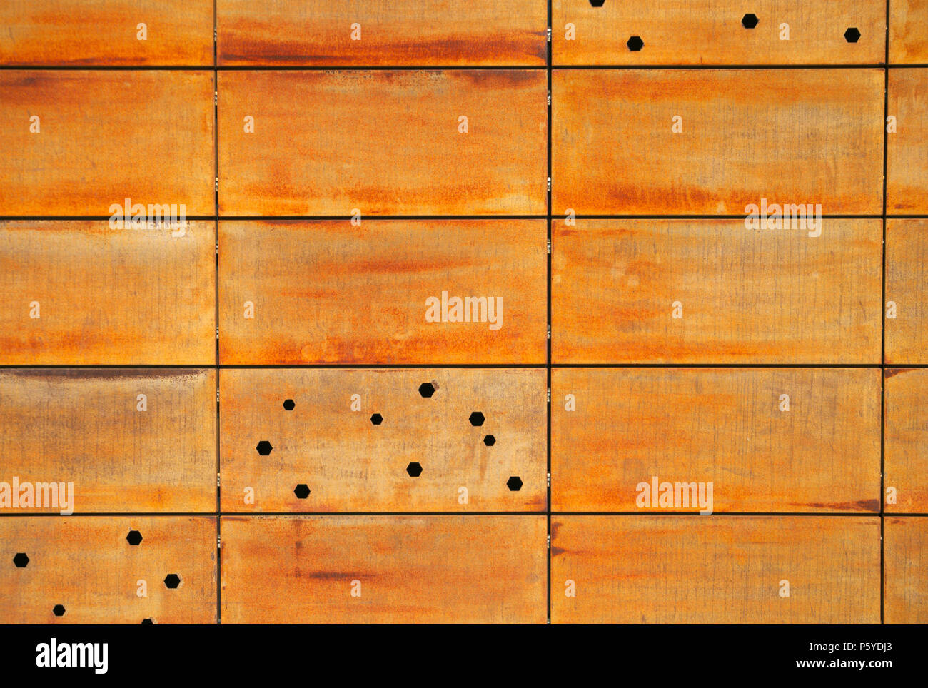 perforated metal panels of modern building facade Stock Photo - Alamy