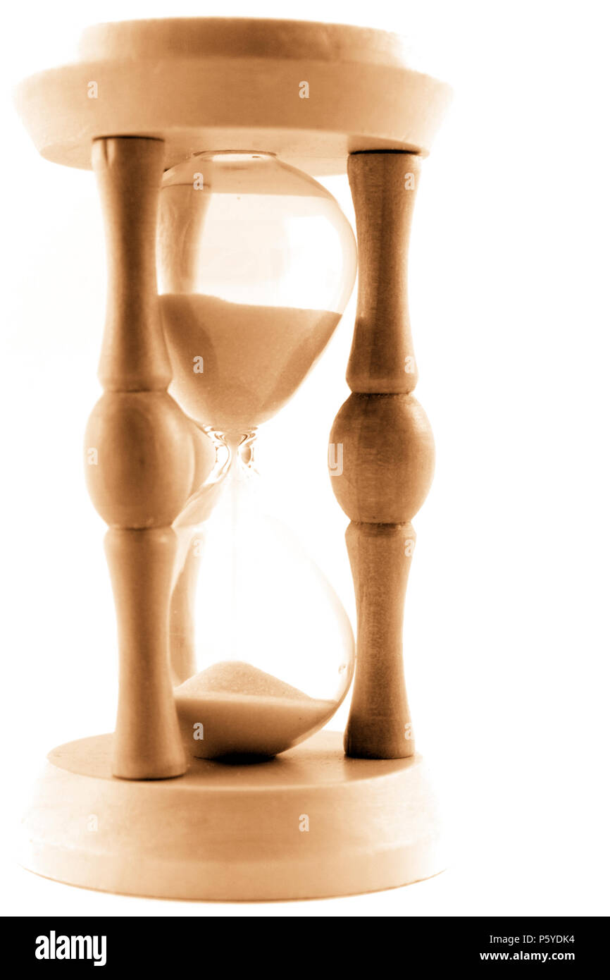 sand clock showing how is time passing on white background Stock Photo ...