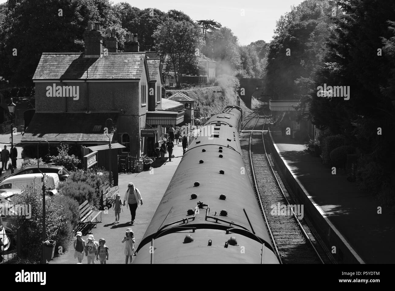 A steam passenger train waiting at a station in the UK Stock Photo - Alamy