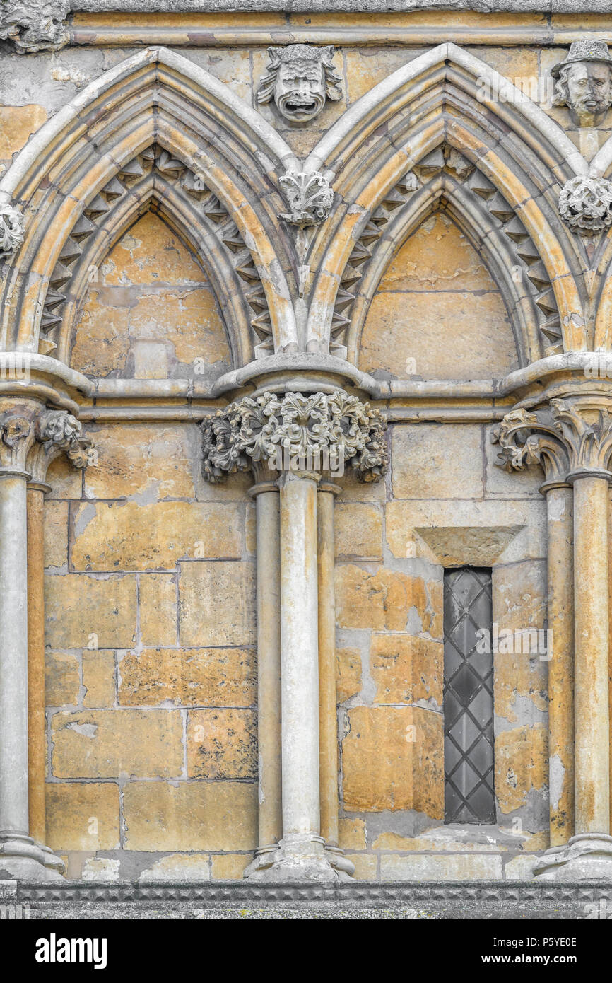 Decorated gothic stone arches on the west wall at the medieval ...