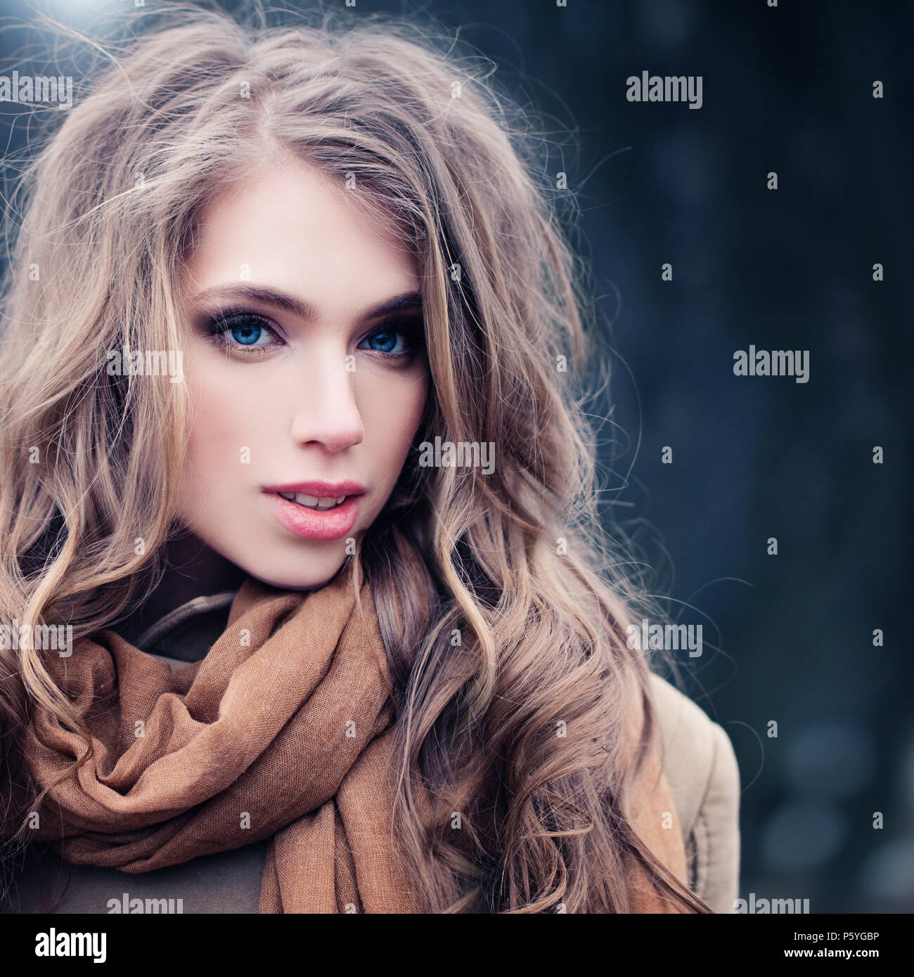 Beautiful Woman Outdoors. Fashion model with Long Wavy Hair Stock Photo ...
