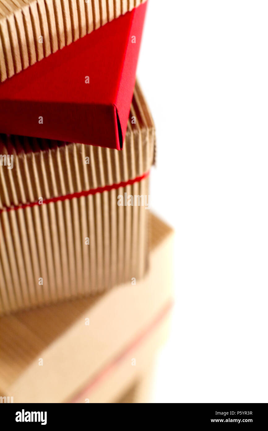 stack of cardboard boxes close up on white background Stock Photo - Alamy