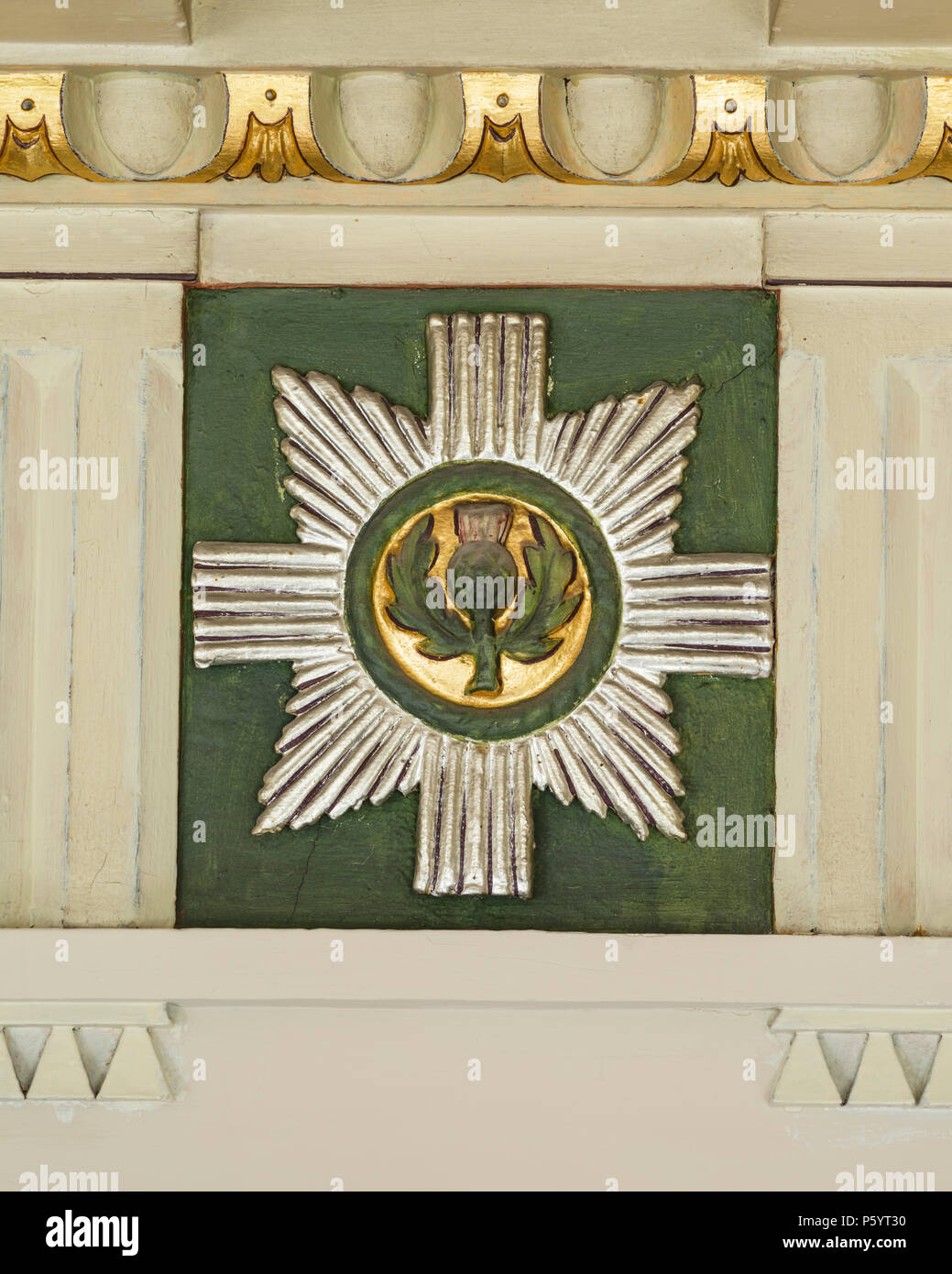 Sculpture of symbol on wall Stock Photo - Alamy