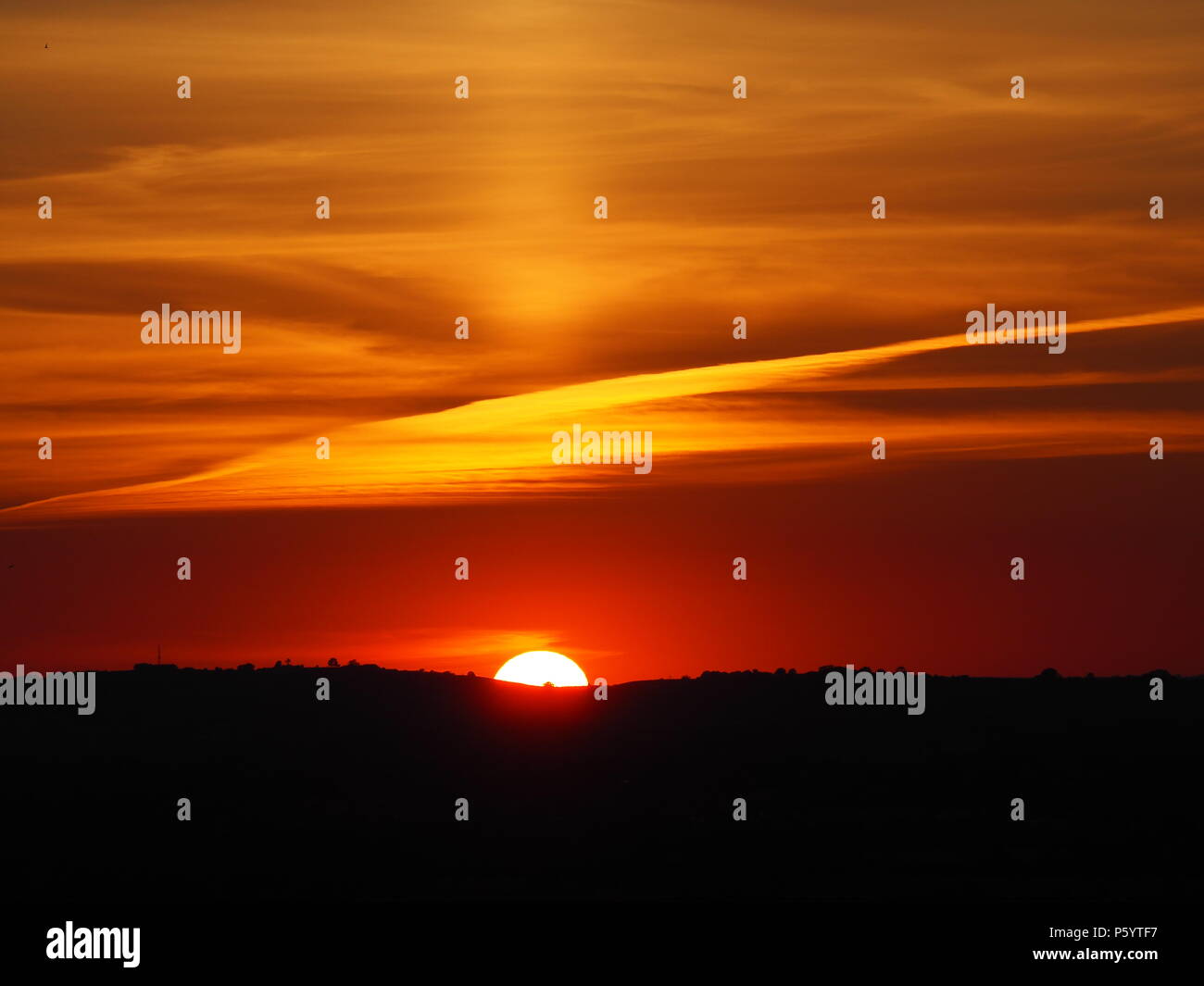 Rare Sun Pillar cirrus cloud phenomenon above a vivid sunset over ...