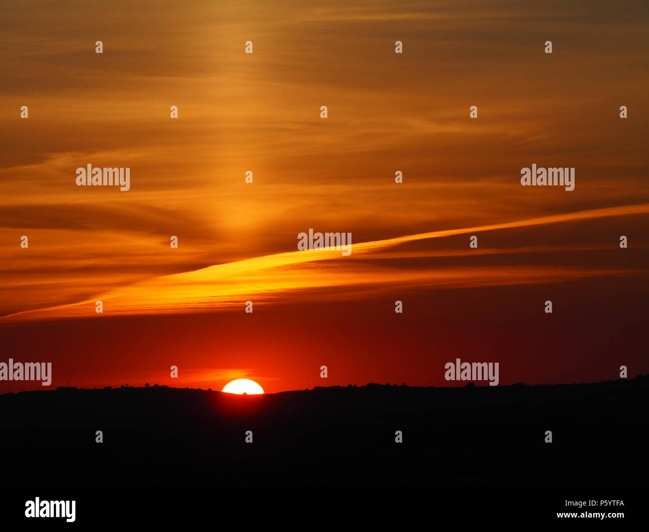 Rare Sun Pillar cirrus cloud phenomenon above a vivid sunset over ...