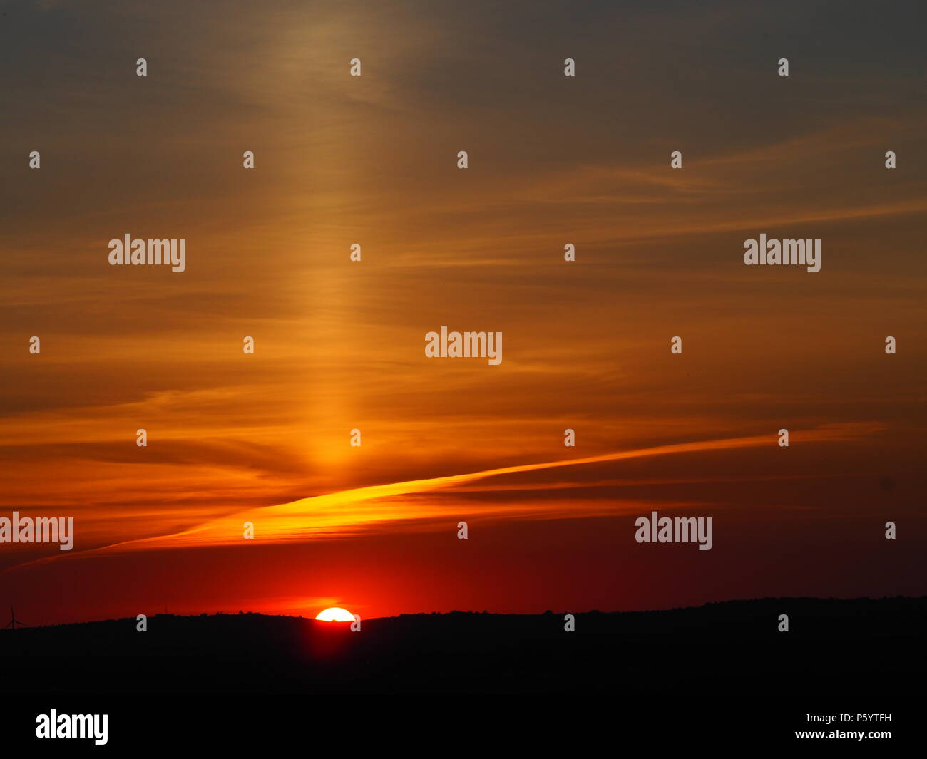 Rare Sun Pillar cirrus cloud phenomenon above a vivid sunset over ...