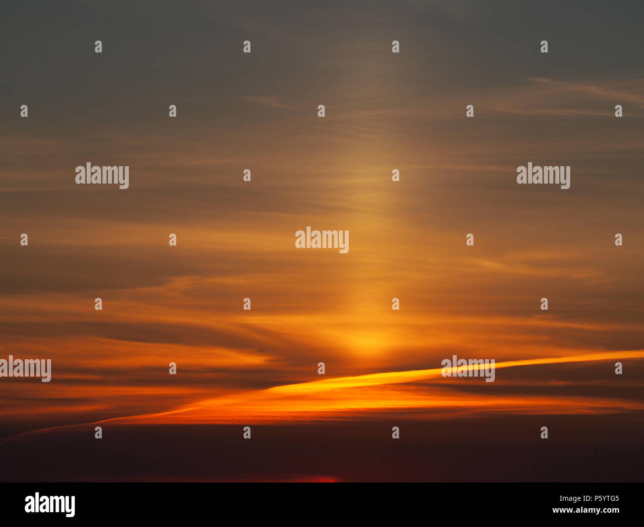 Rare Sun Pillar cirrus cloud phenomenon above a vivid sunset over ...