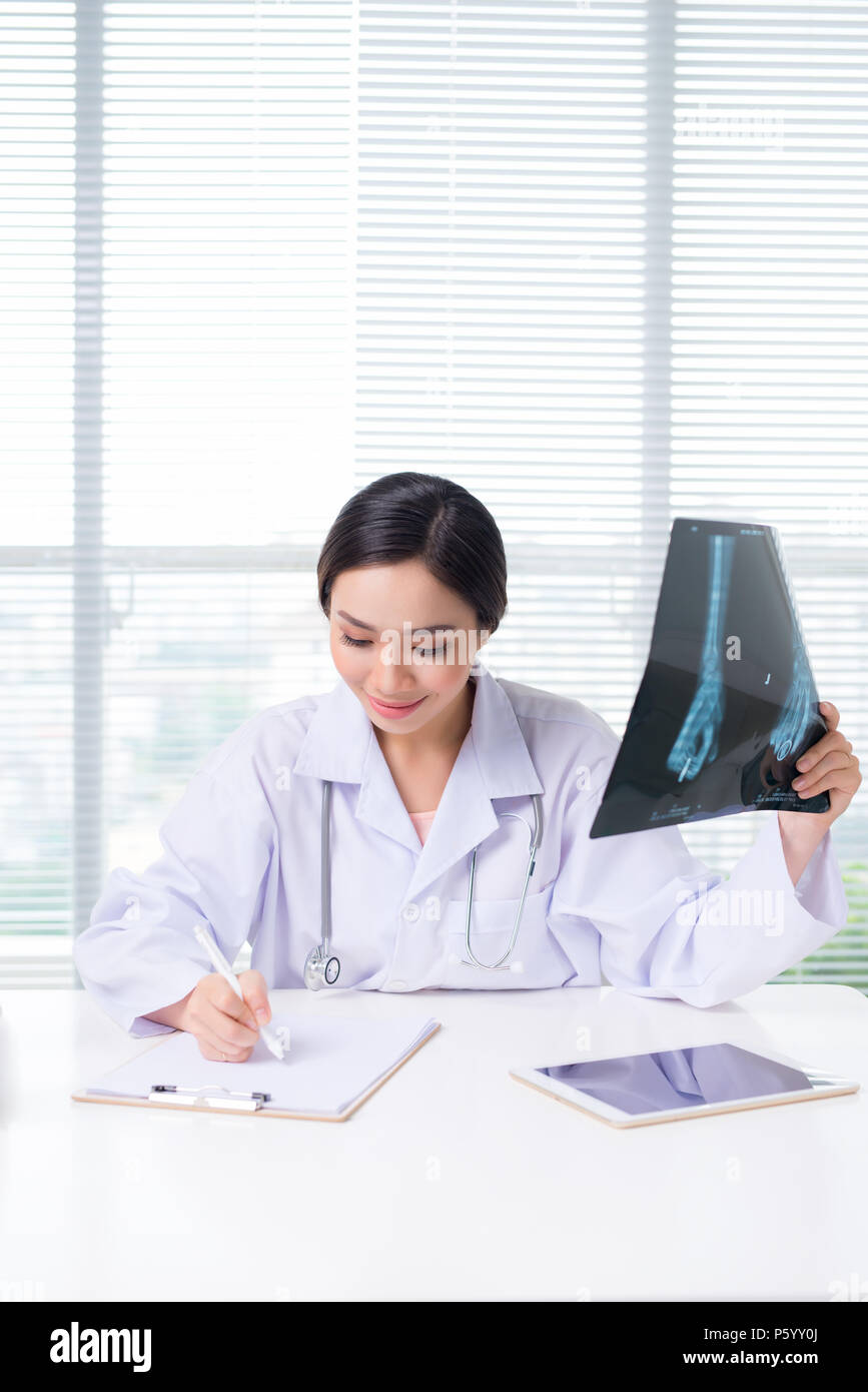 Medical asian doctor working with hologram interface at hospital Stock ...