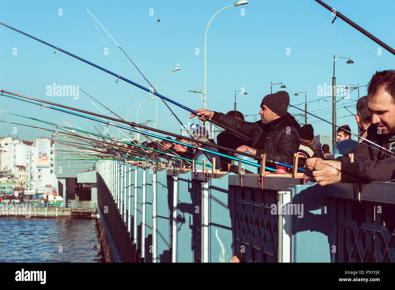 Istanbul, Turkey - January 06, 2018: Local fishermen fishing on Galata ...