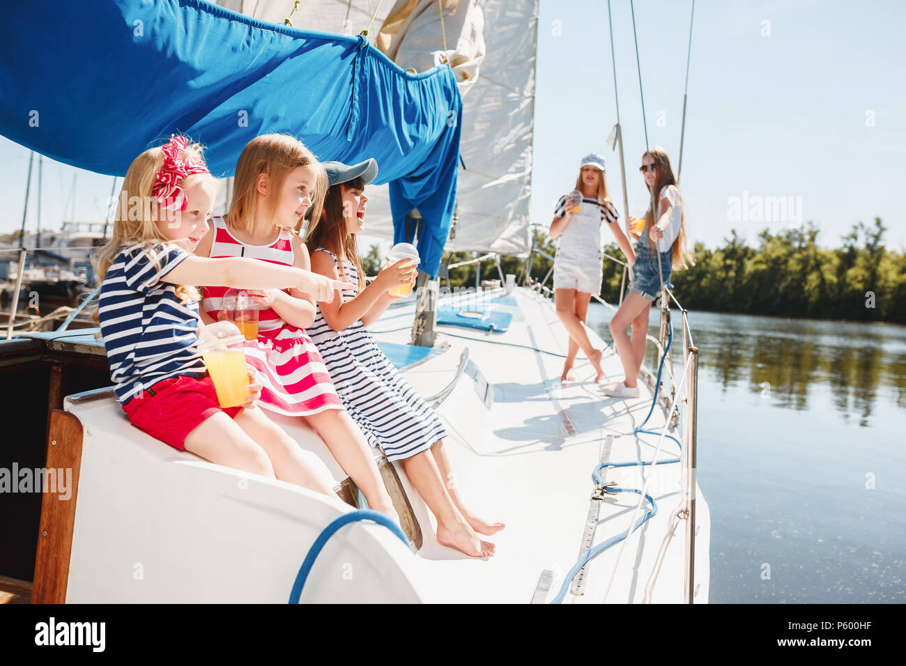 The children on board of sea yacht Stock Photo - Alamy