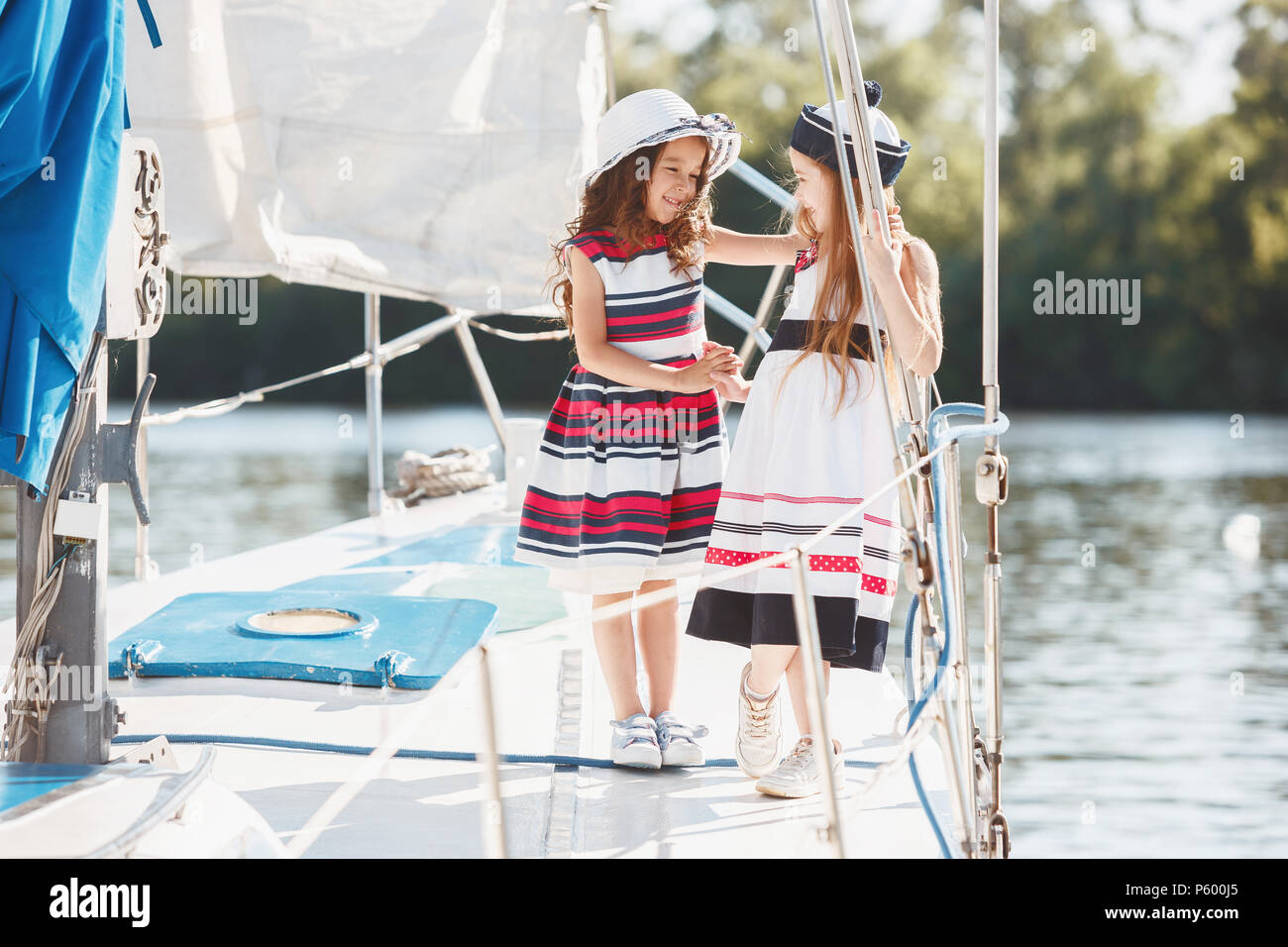 The children on board of sea yacht Stock Photo - Alamy
