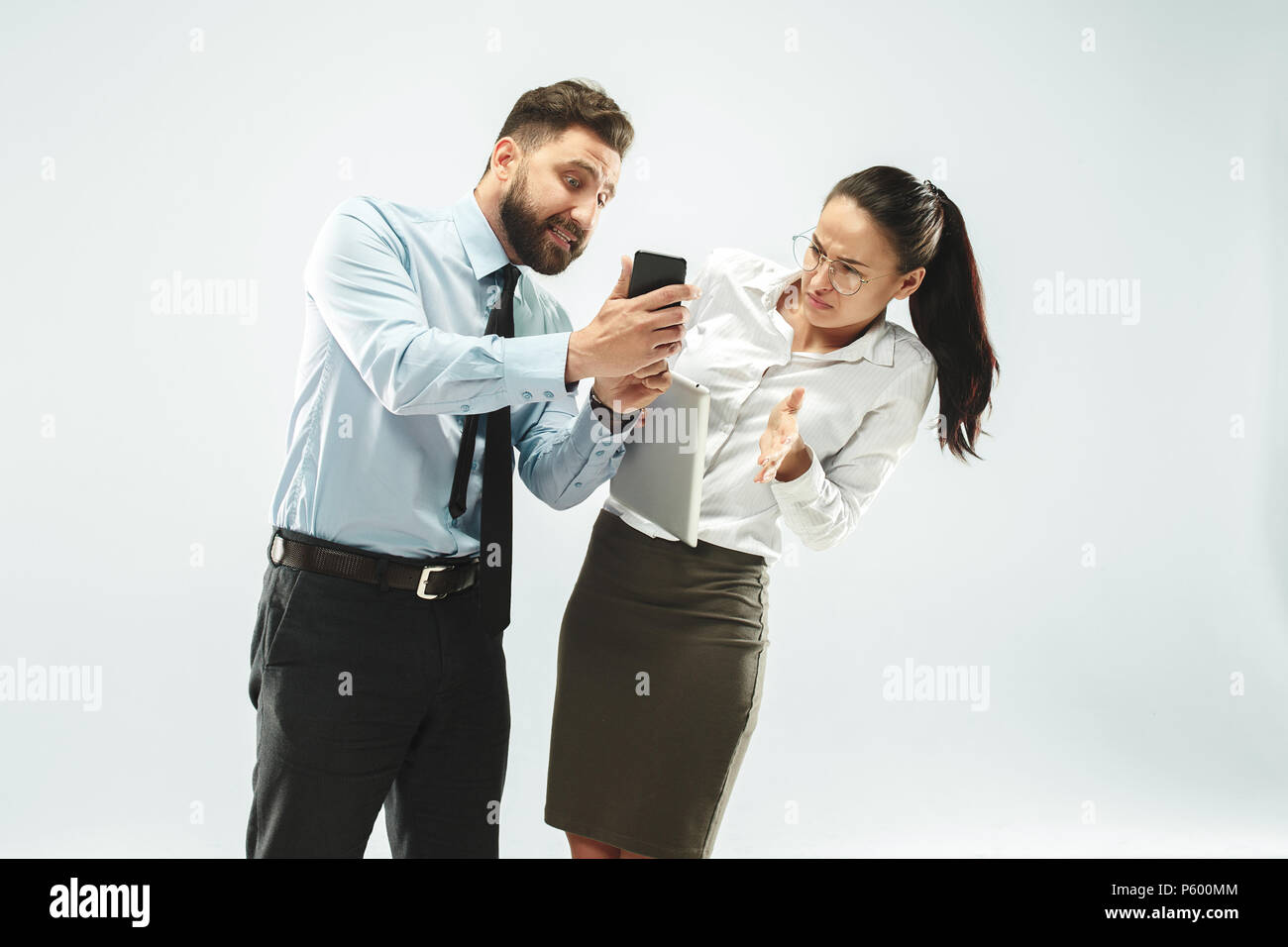 angry businessman and his colleague in the office Stock Photo - Alamy