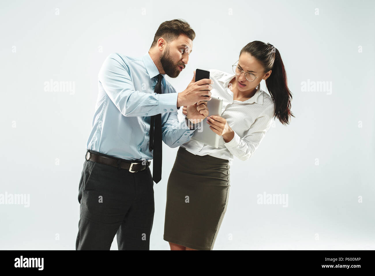 angry businessman and his colleague in the office Stock Photo - Alamy