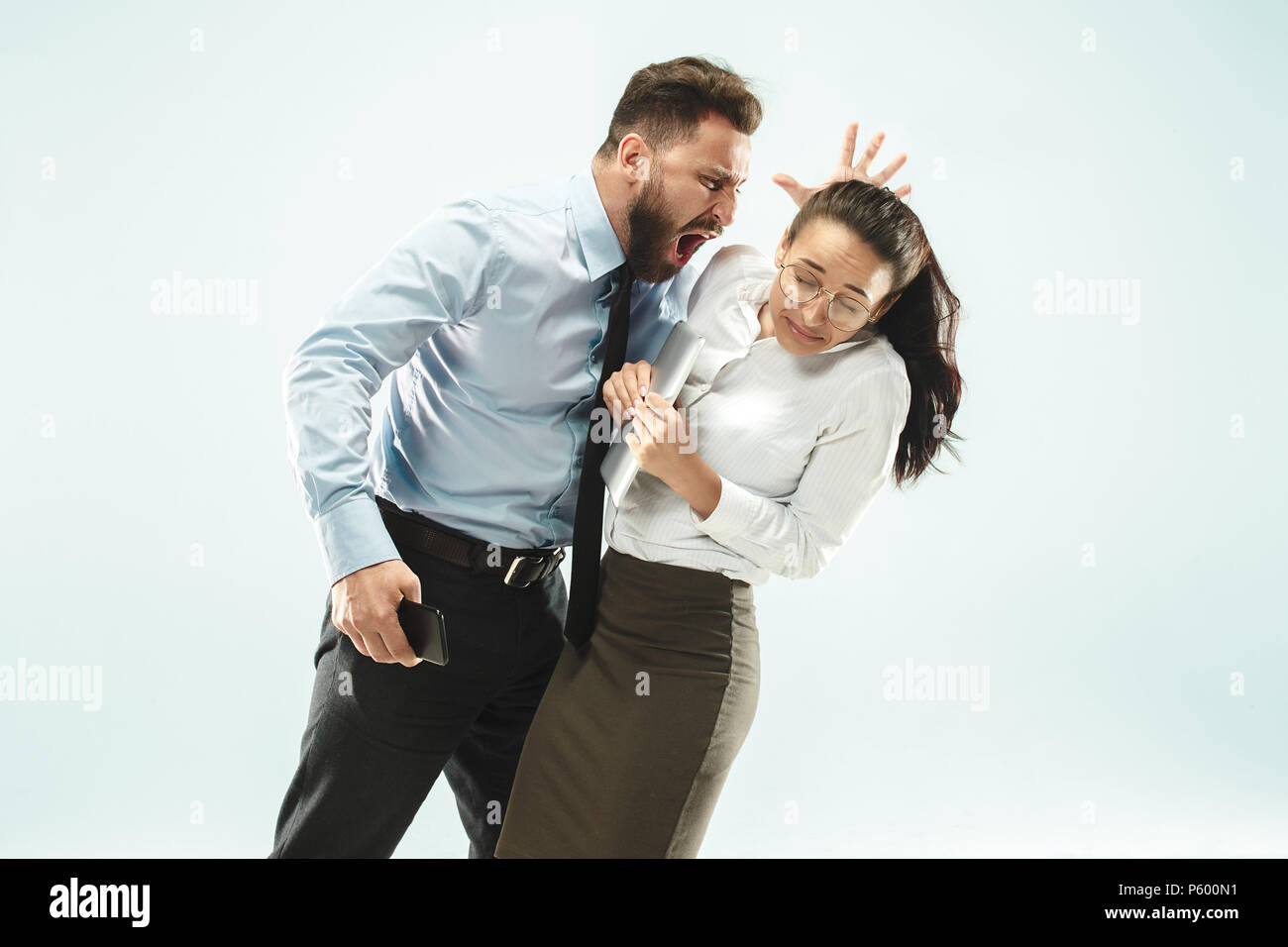 angry businessman and his colleague in the office Stock Photo - Alamy