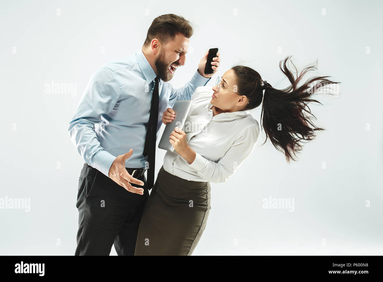 angry businessman and his colleague in the office Stock Photo - Alamy