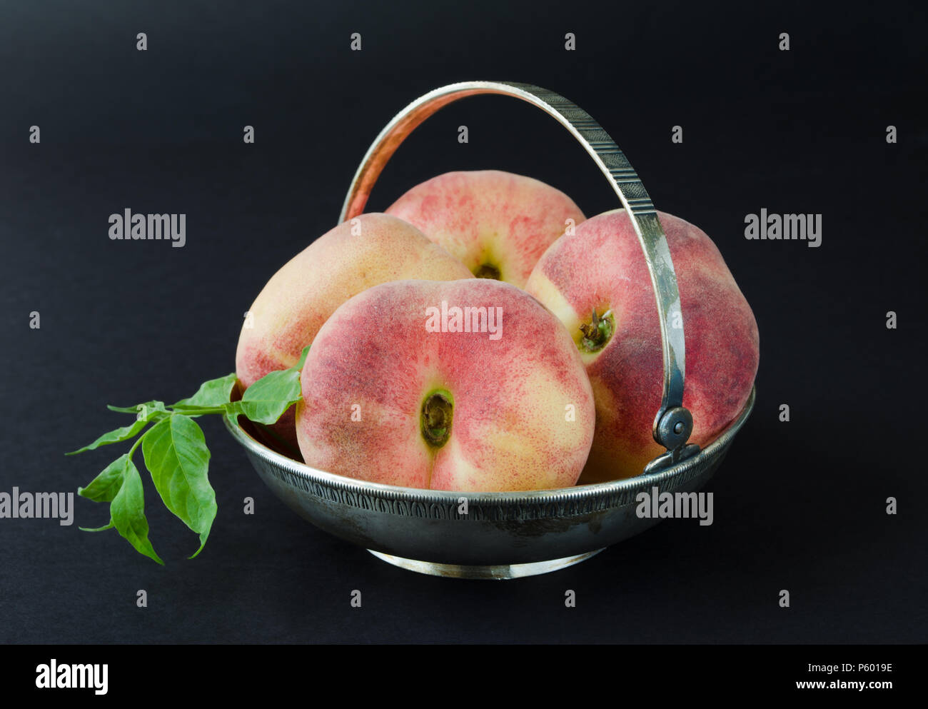 Saturn peaches or donut, UFO, flat peaches on black background Stock ...