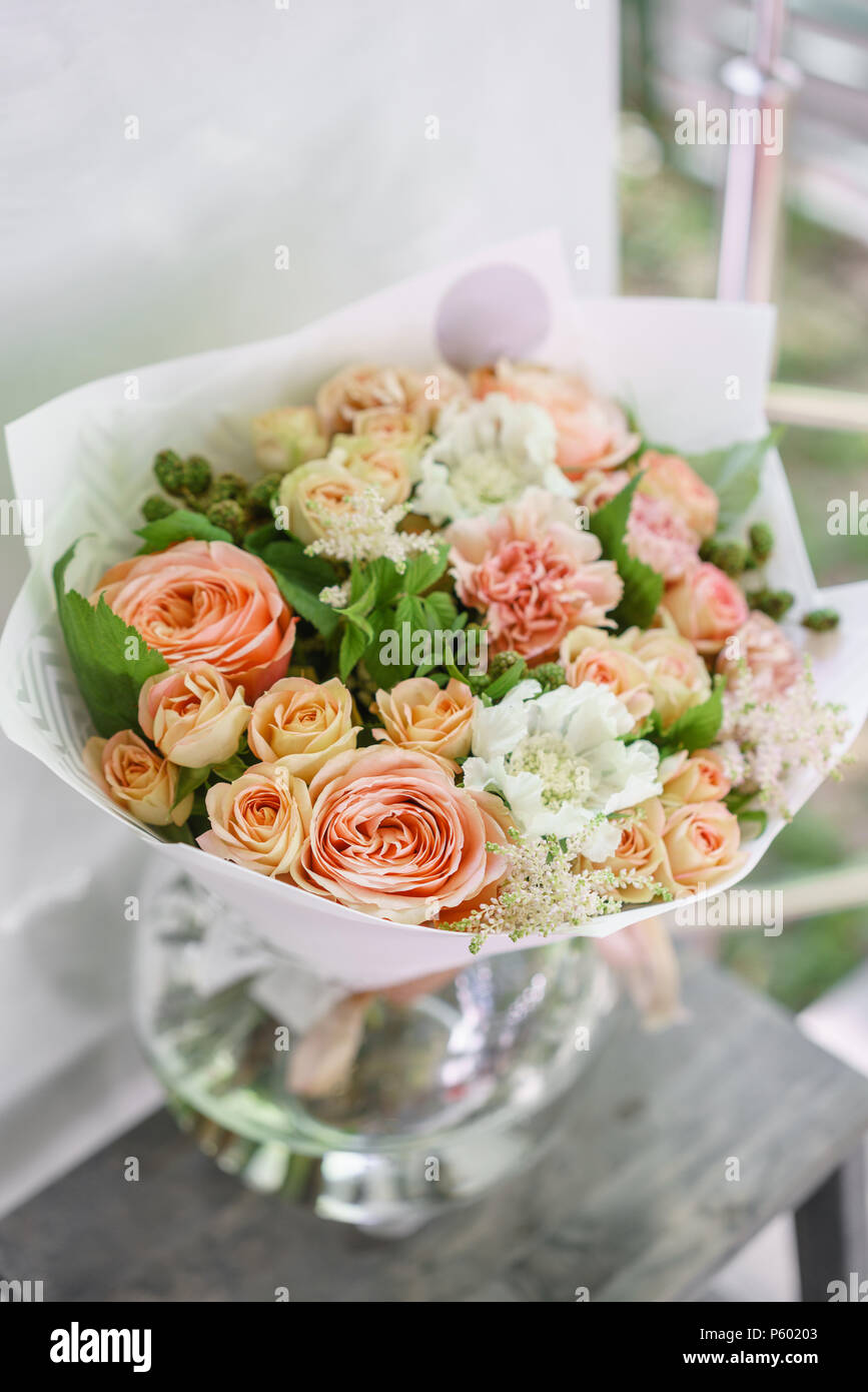 Work florist. Beautiful spring bouquet. Arrangement with mix flowers ...