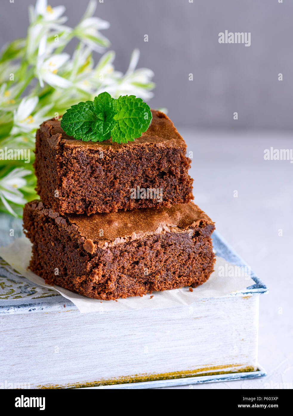 two square baked pieces of chocolate brownie pie, close up Stock Photo ...