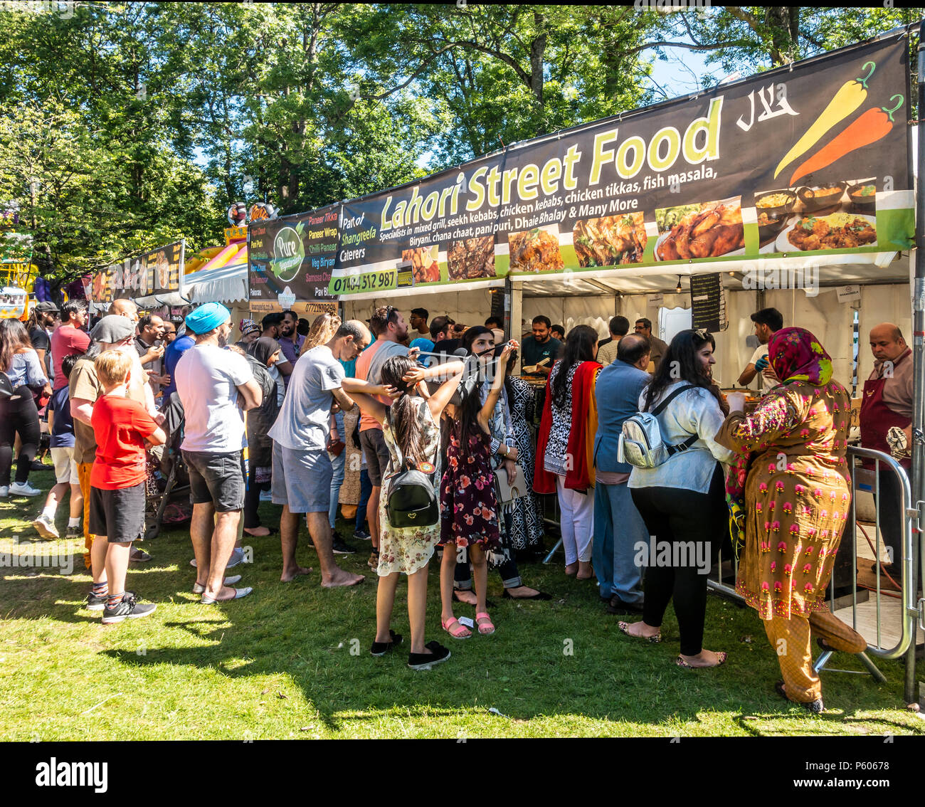 Multi-ethnic crowd queueing to buy a meal from the Lahore Street Food ...