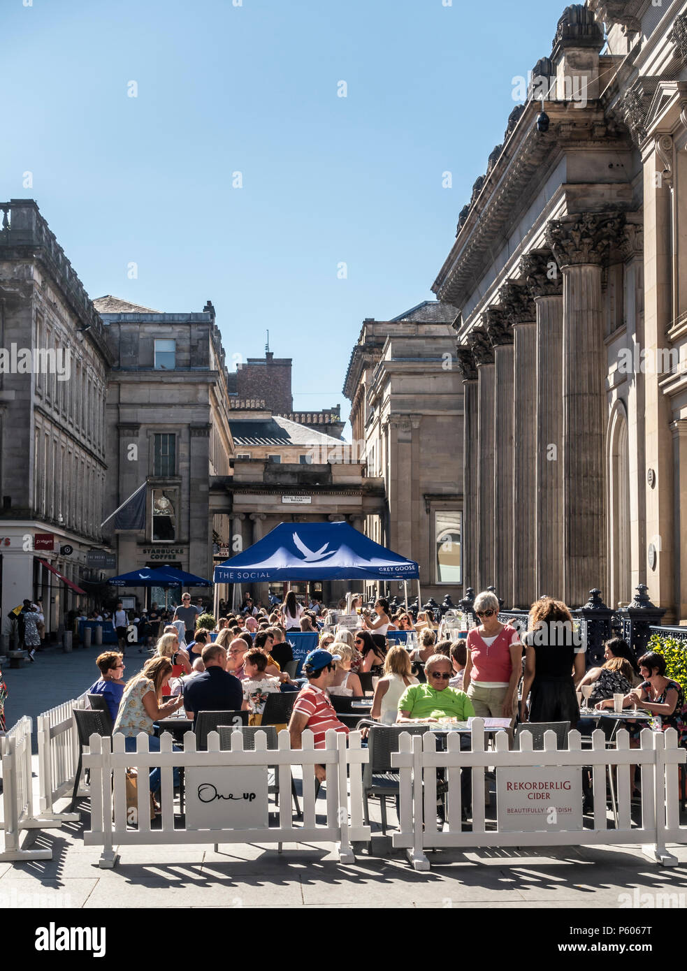 Customers on a warm summer evening / later afternoon in the outdoor ...