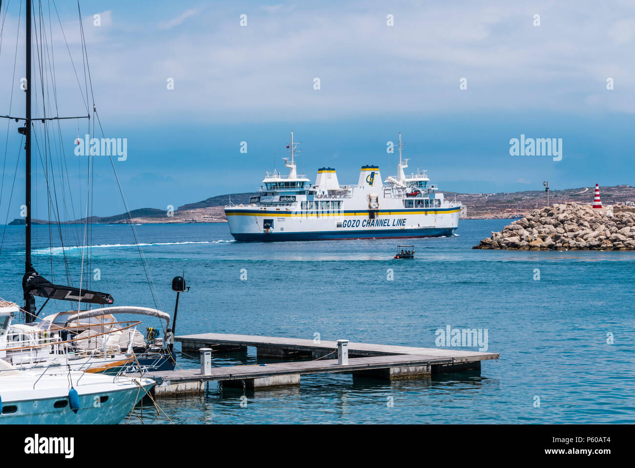 Gozo Channel Line ferry leaving Mgarr Harbour, Gozo, Malta Stock Photo ...