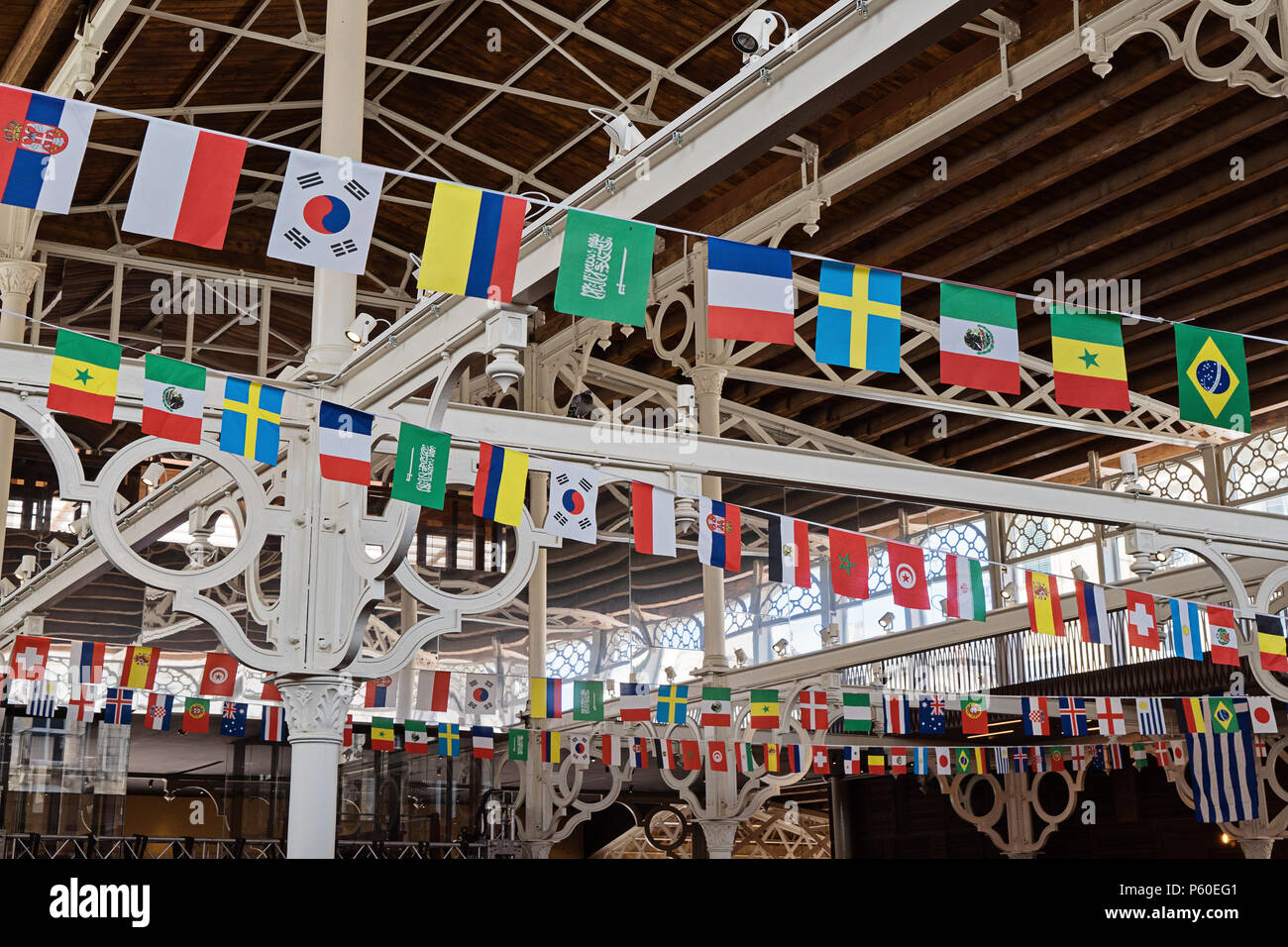 Interior of sports pub decorated with flags of countries for the ...