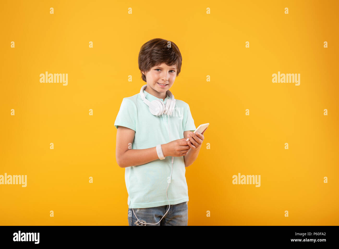 Cheerful boy using his modern phone Stock Photo - Alamy