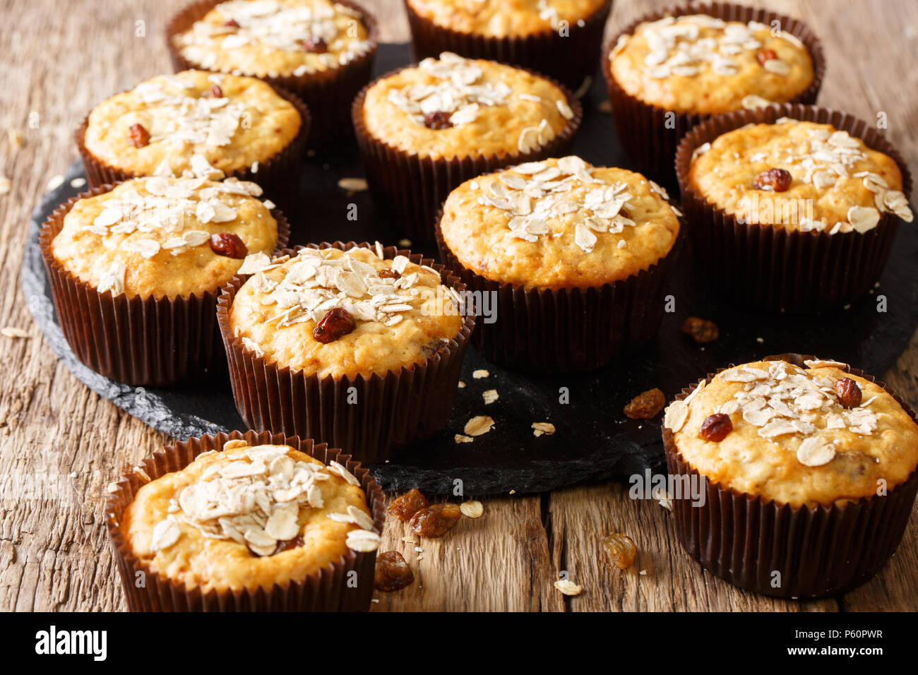 Dietary muffins from oat flakes with raisins and honey close-up on the ...