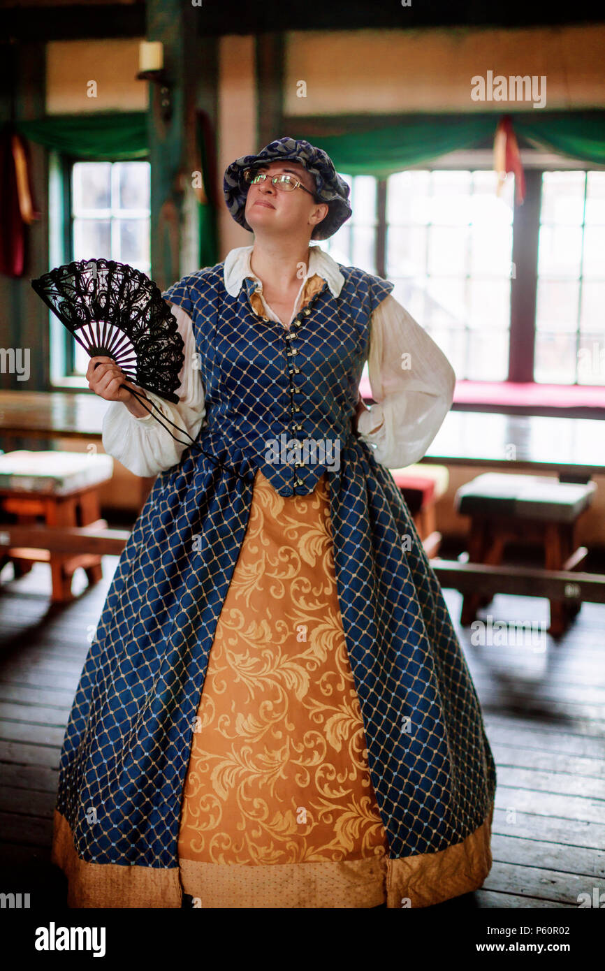 A Renaissance fair actor stands for her portrait in the main house ...