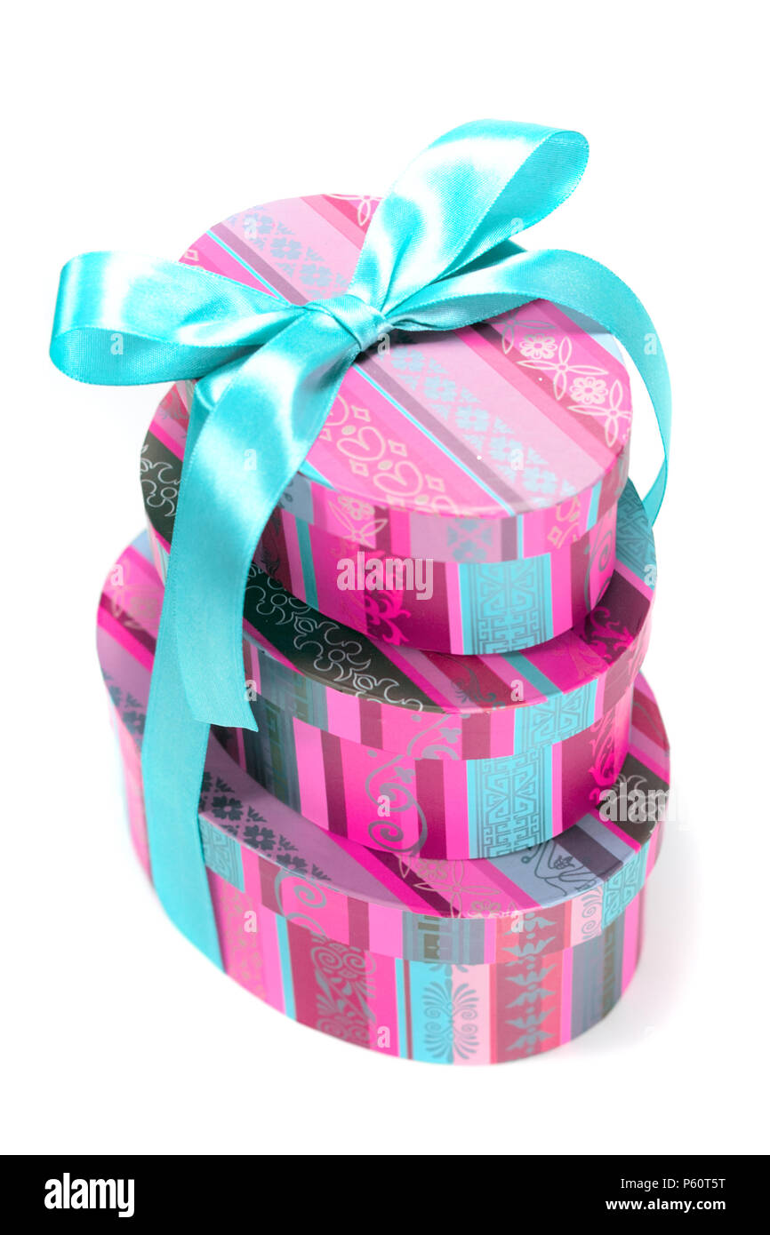 pyramid of colorfull gift boxes with blue bow closeup on white ...