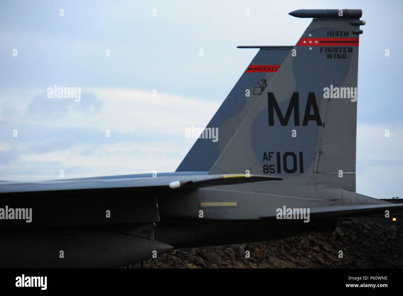 The tail of a U.S. Air Force F-15C Eagle fighter aircraft assigned to ...