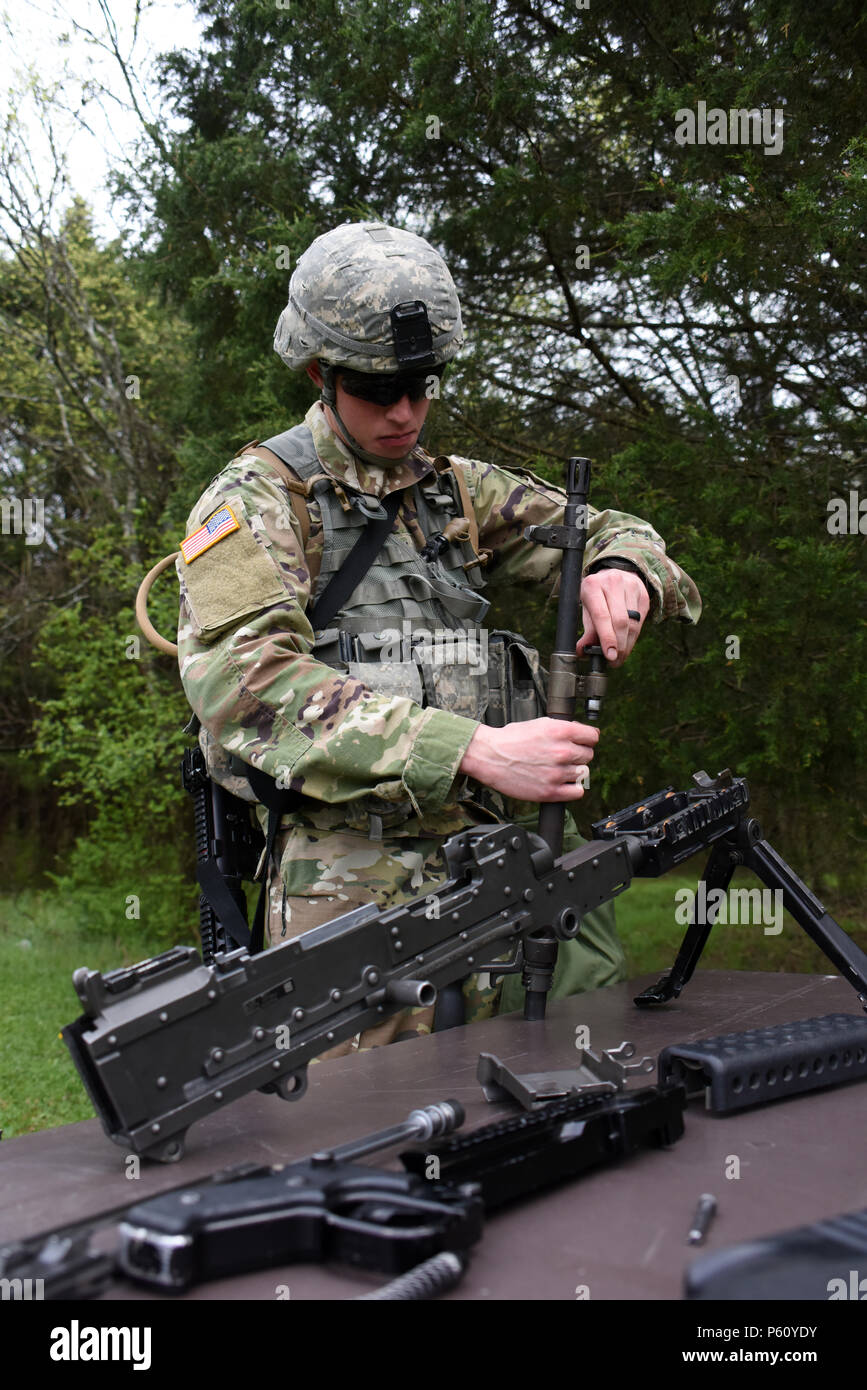 A Soldier at the Best Warrior Competition reassembles a .50 caliber ...