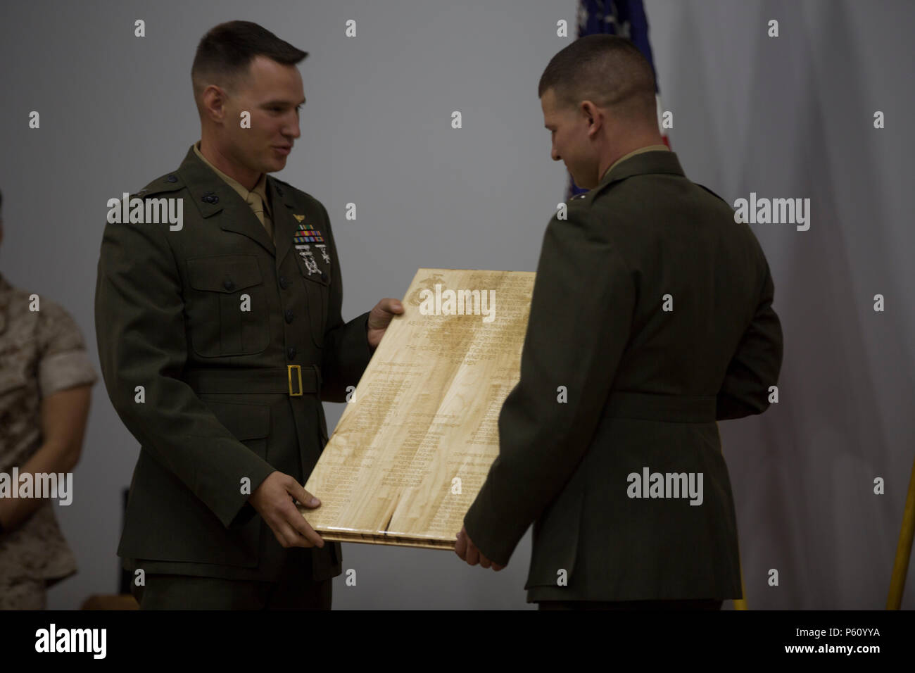Captain Dimitri Stepanoff, executive officer, Communication Training Battalion, accepts a gift ...