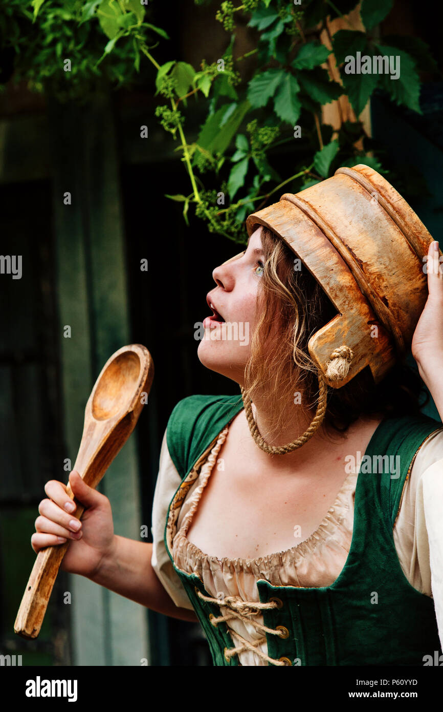 A Renaissance fair actor milk maid portrays her playful character Stock ...