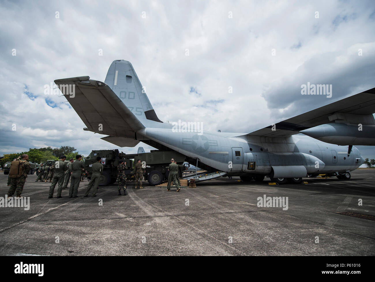 U.S. Marine Corps and Philippine Air Force members watch a M142 High ...