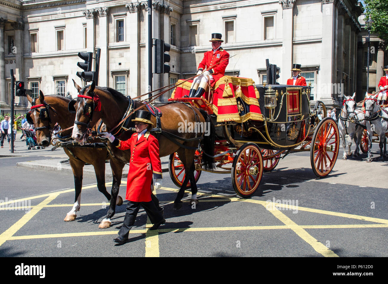 London, UK, 27 June 2018 Royal carriages in transit pass the National ...