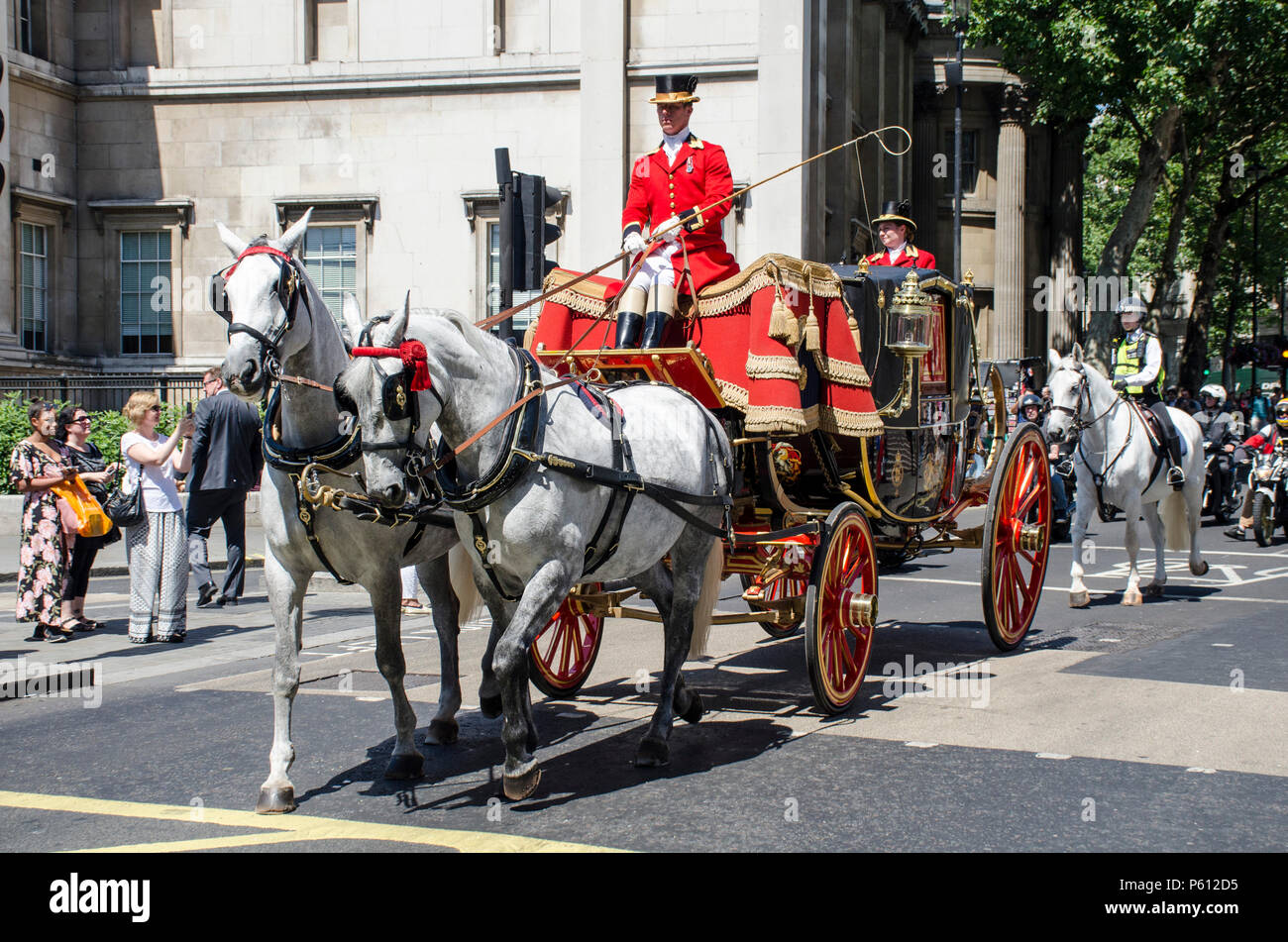 London, UK, 27 June 2018 Royal carriages in transit pass the National ...