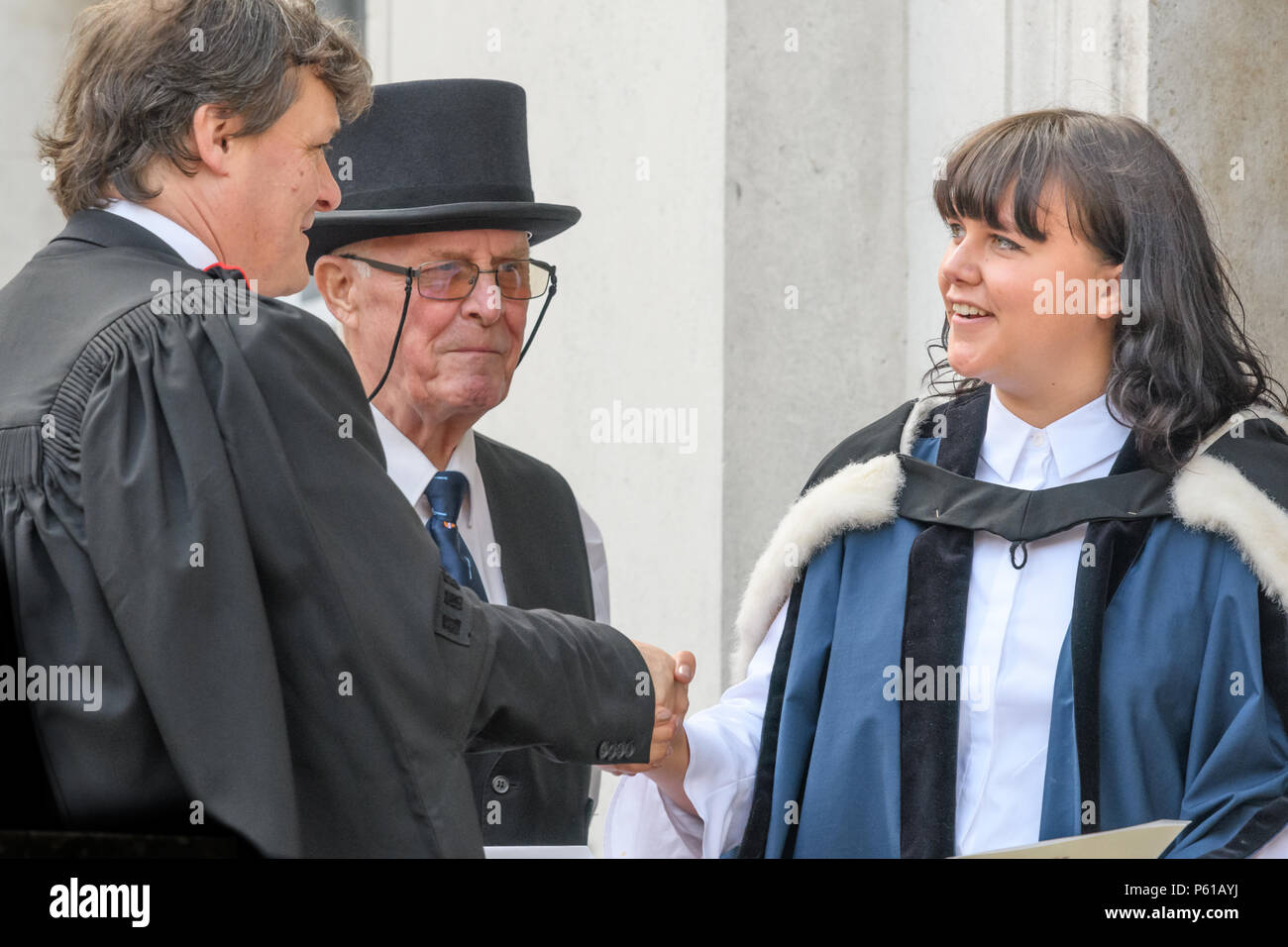 Cambridge University, UK. 28th Jun 2018. A delighted newly qualified ...