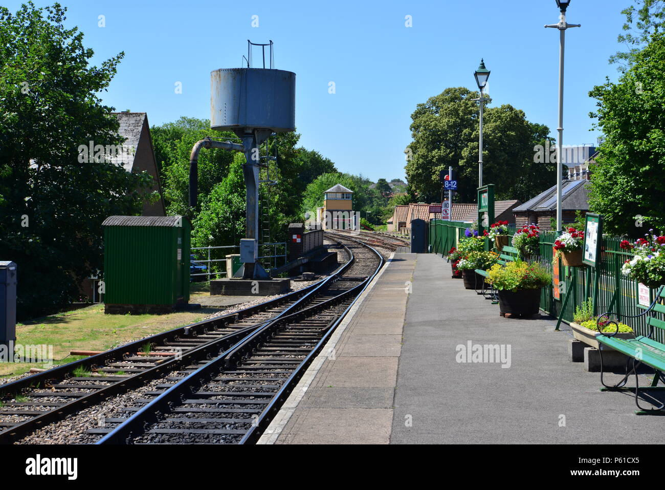 Water tower at the rear of a vintage railway station in the UK Stock ...