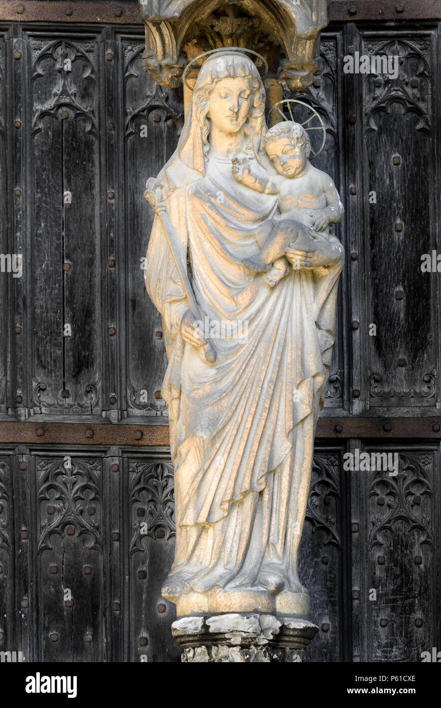 Statue of Mary and Jesus outside a south door at the medieval cathedral ...